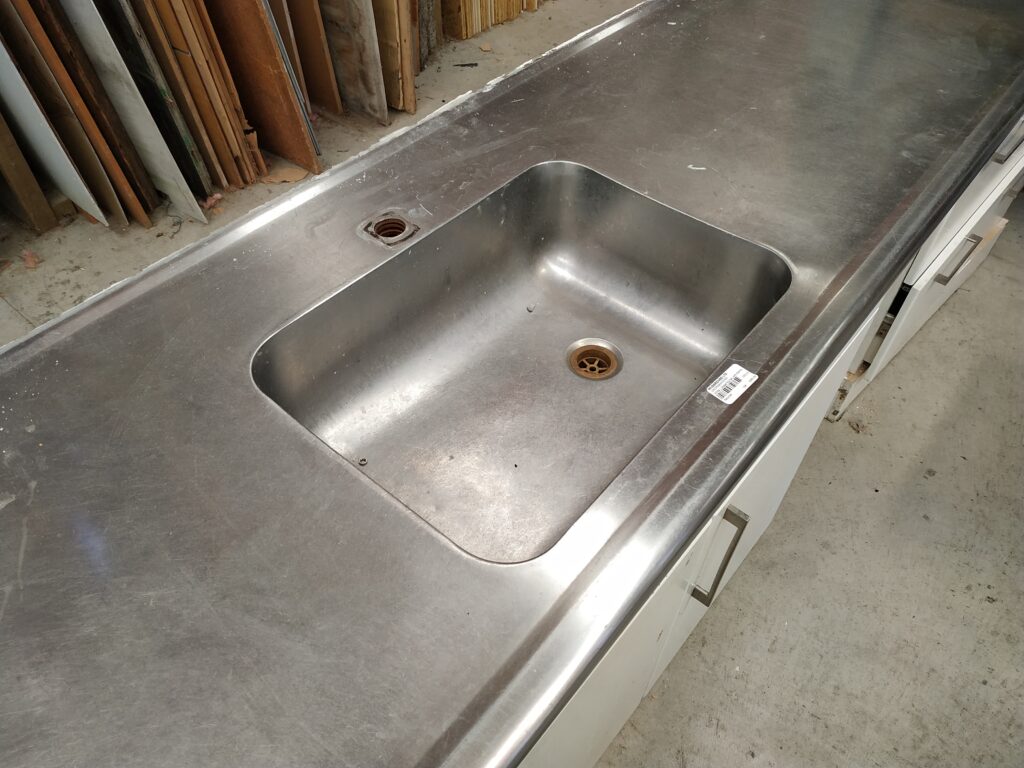 White L Shape Kitchen with Stainless Steel Top | Musgroves Ltd